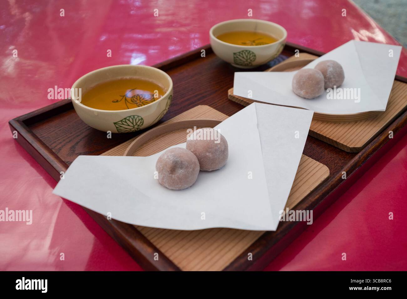 Delicious mochi Monkey rice cakes desserts paired with fresh tea served ...