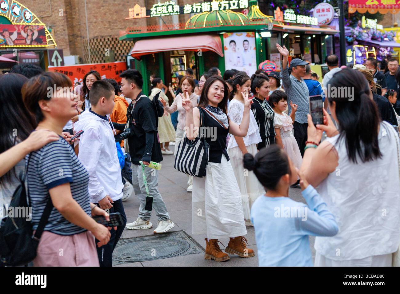 Tourists visit the Grand Bazaar in Urumqi City, northwest China's ...