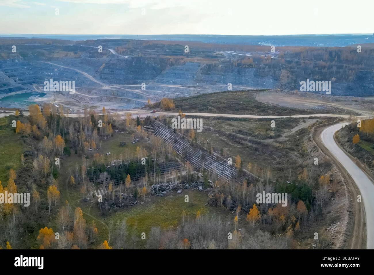 An old marble quarry overgrown with trees Stock Photo - Alamy