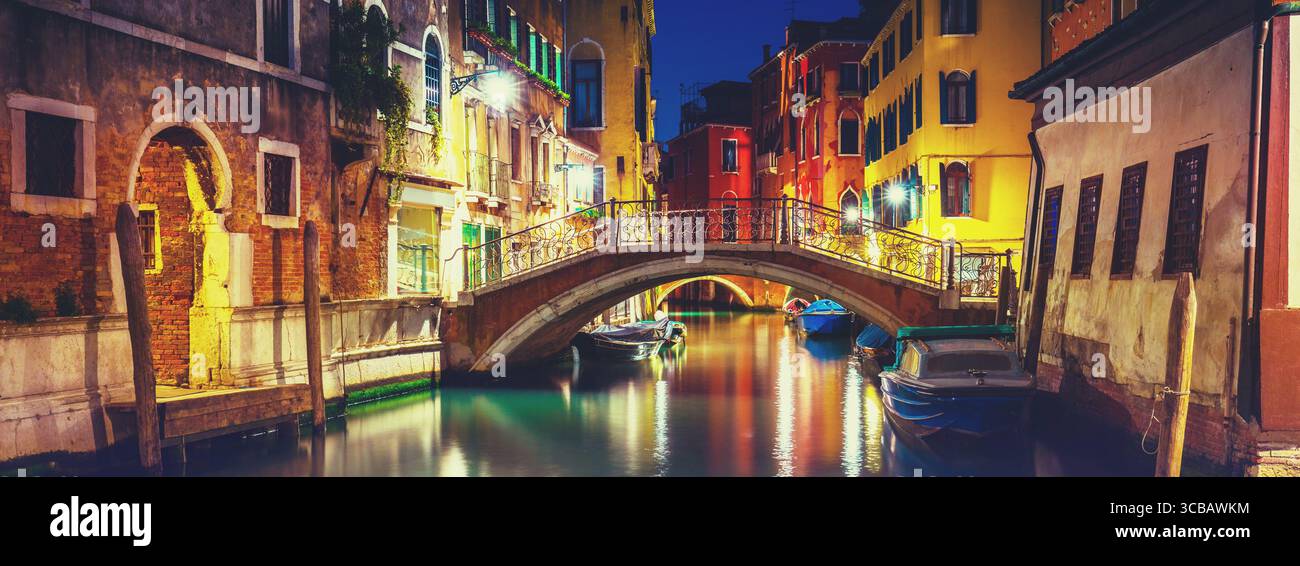 Venice street at night, bridge over canal, Venice, Italy. Horizontal ...