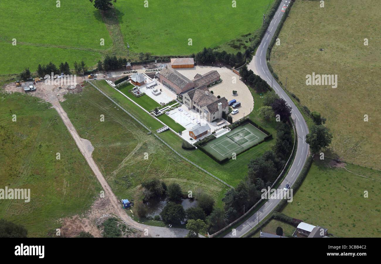 aerial view of a newly built detached house with tennis court nr ...