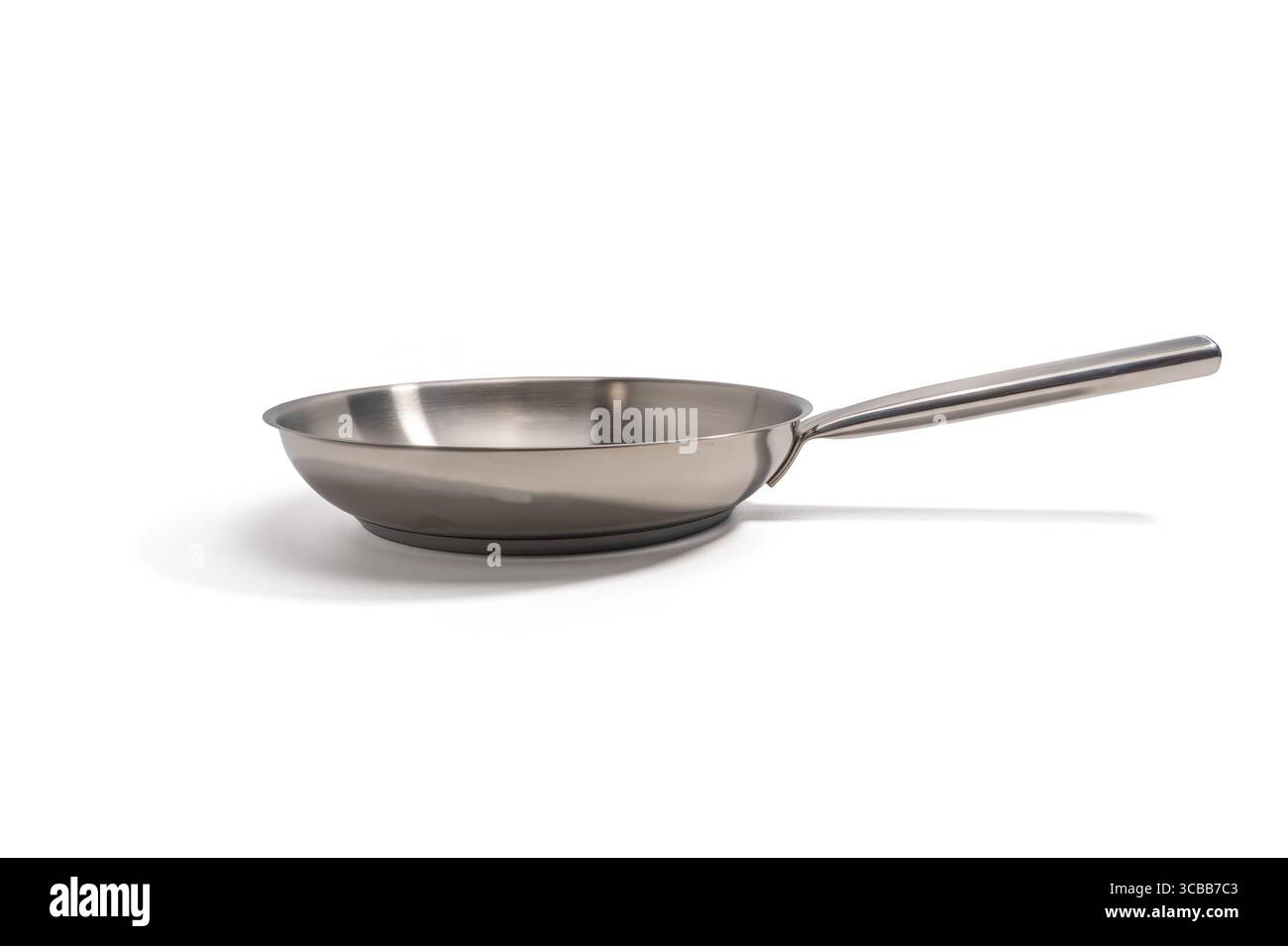 Stainless steel frying pan side view. The sleek stainless steel frying ...