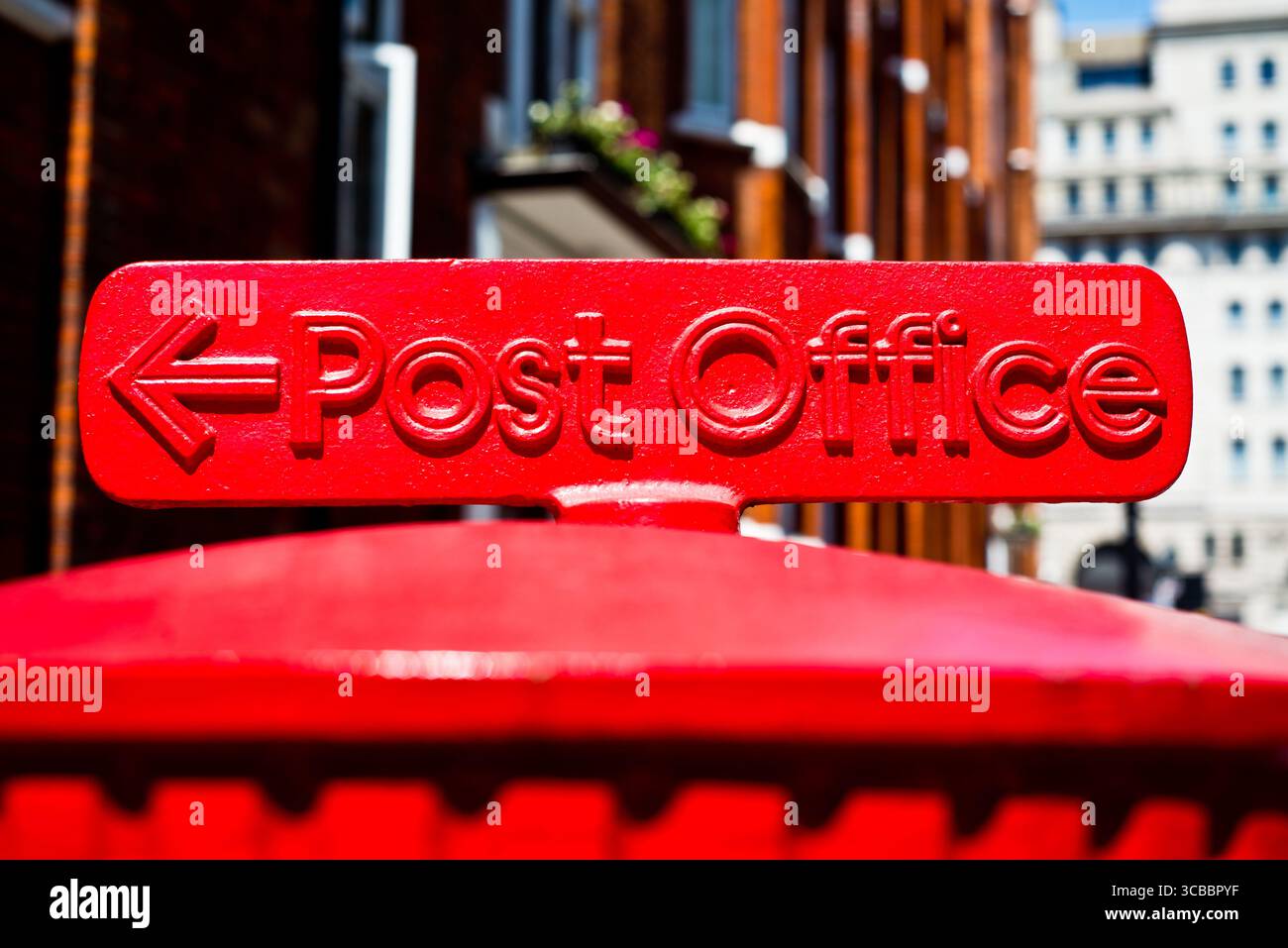 Post Office Direction Sign on post box, Chiltern Street, Marylebone ...