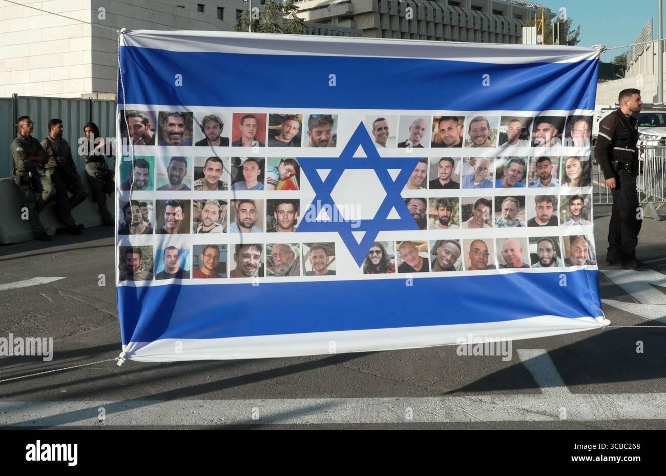 JERUSALEM - AUGUST 7: An Israeli flag with pictures of hostages hangs ...