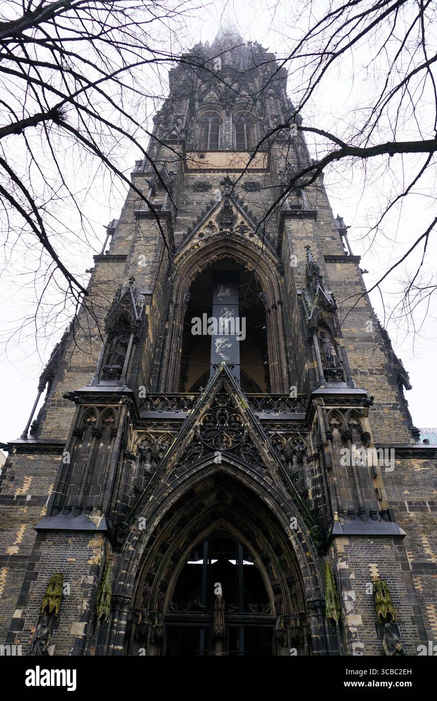 The Gothic church tower and spire at the front portal of St. Nicholas ...