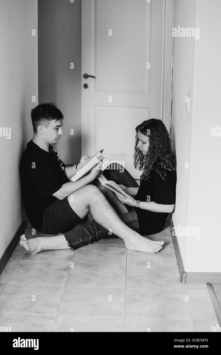 Reading two people Black and White Stock Photos & Images - Alamy