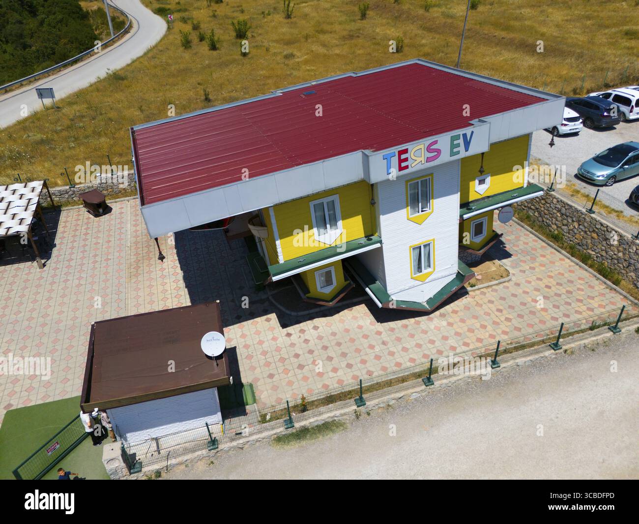Building with car park against a rural backdrop, aerial view, Ters Ev ...
