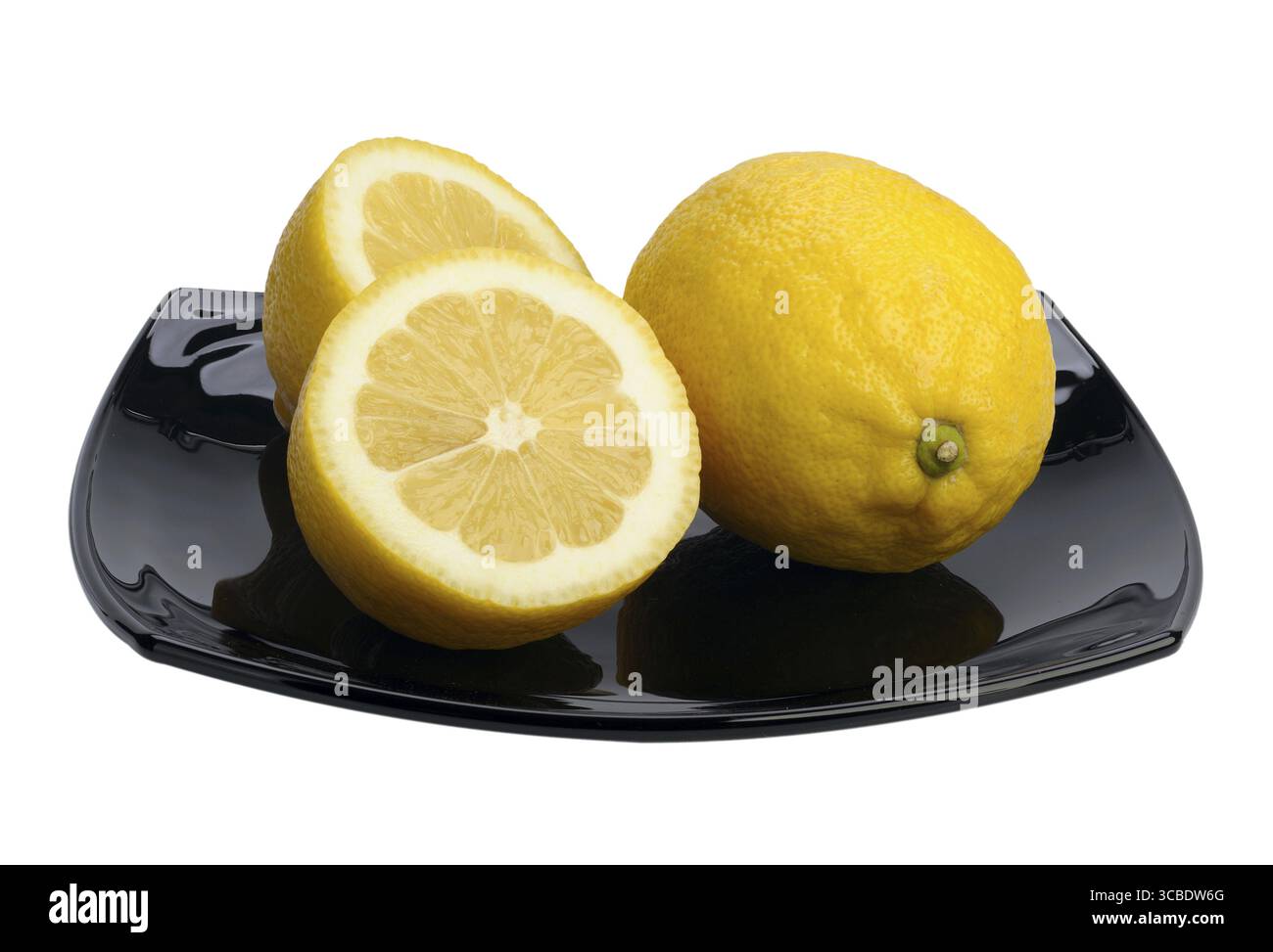 Lemons on white plate Cut Out Stock Images & Pictures - Alamy