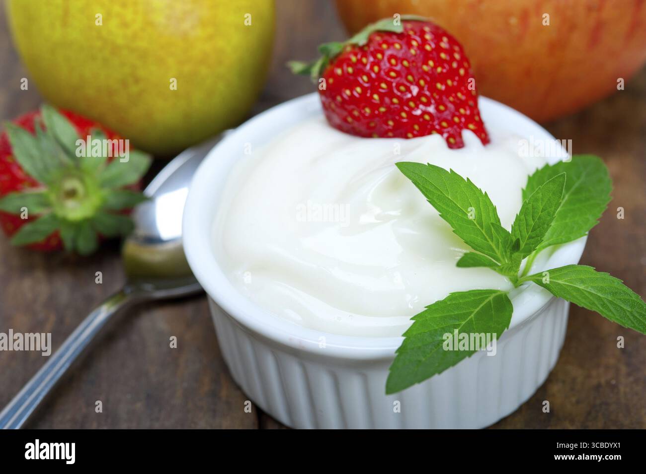 Fresh fruits and whole milk yogurt on a rustic wood table Stock Photo ...
