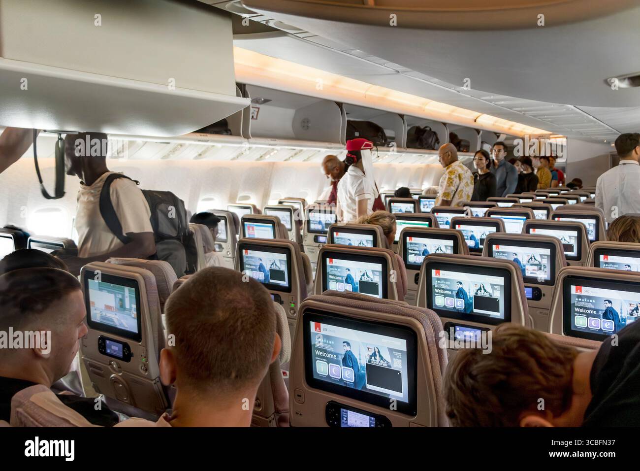 Interior view of a Emirates Boeing 777 airplane economy class cabin ...