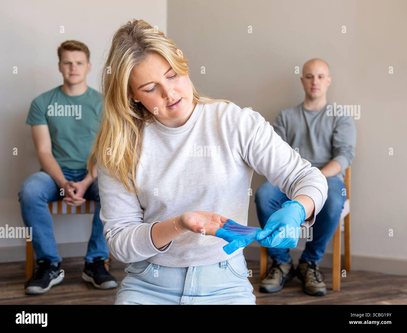 Taking off protective equipment hand hi-res stock photography and ...