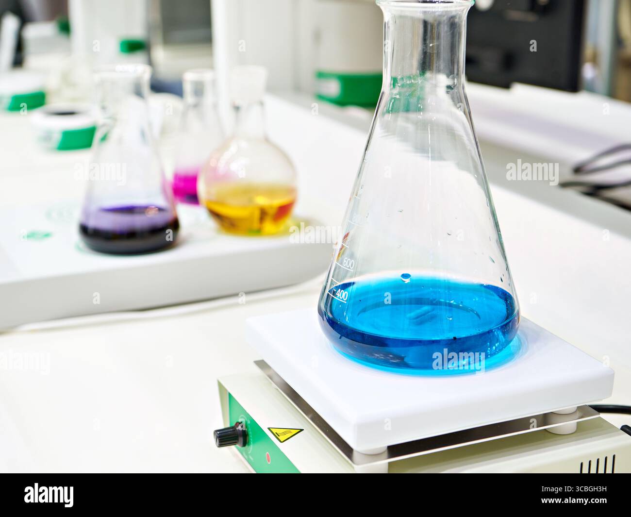 Flasks and magnetic stirrer with heating in chemical laboratory Stock ...