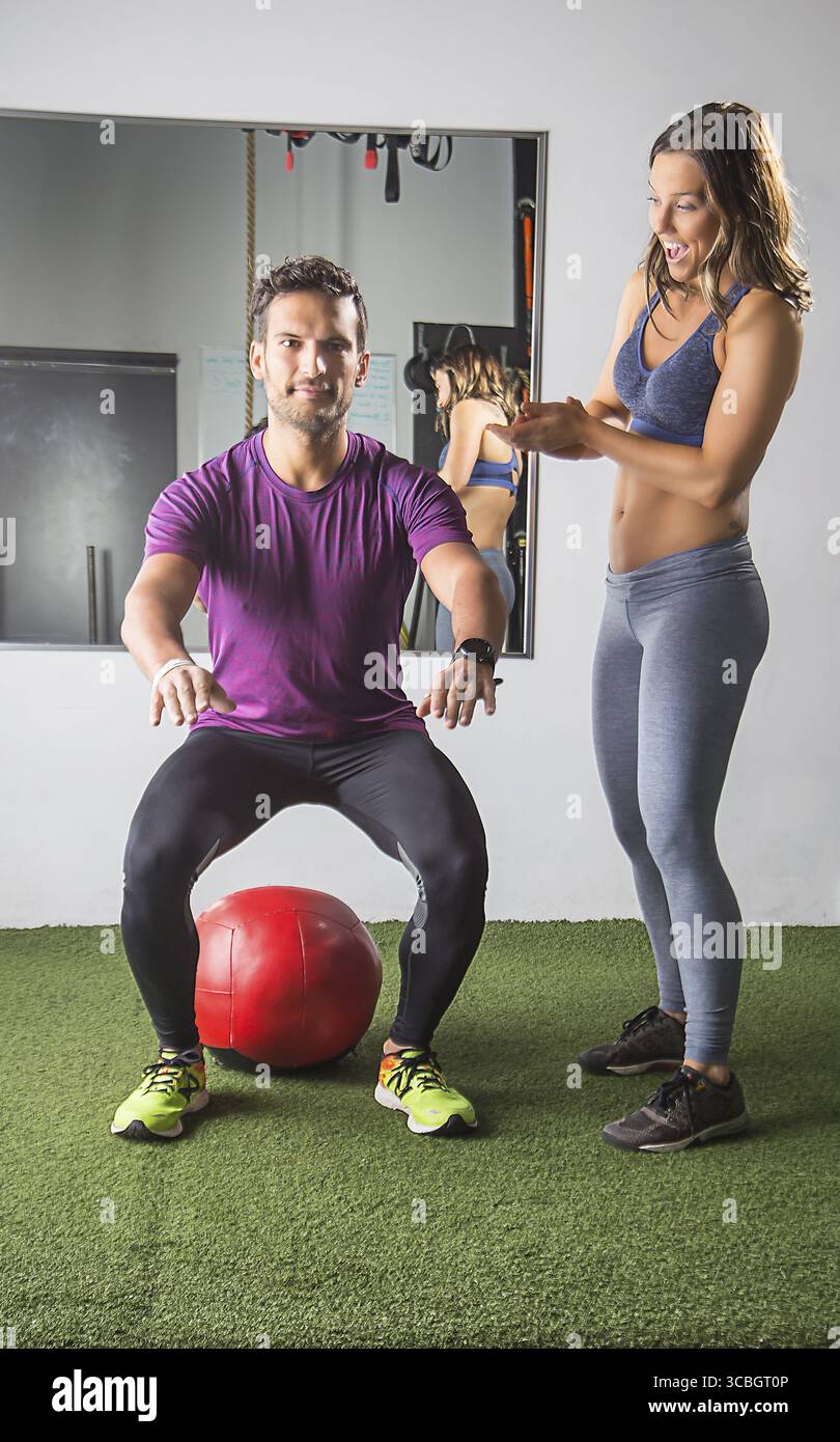 Partner squats hi-res stock photography and images - Alamy