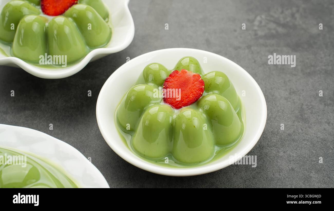Matcha pudding dessert with strawberry topping Stock Photo - Alamy