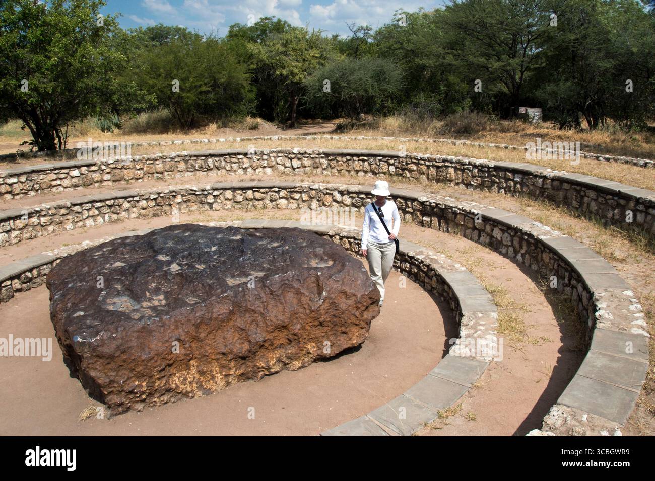 A woman tourist views the Hoba meteorite, the largest known meteorite ...