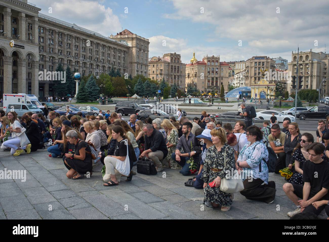 Journalists kneel during the funeral ceremony of Victoria Roshchyna, 27 ...