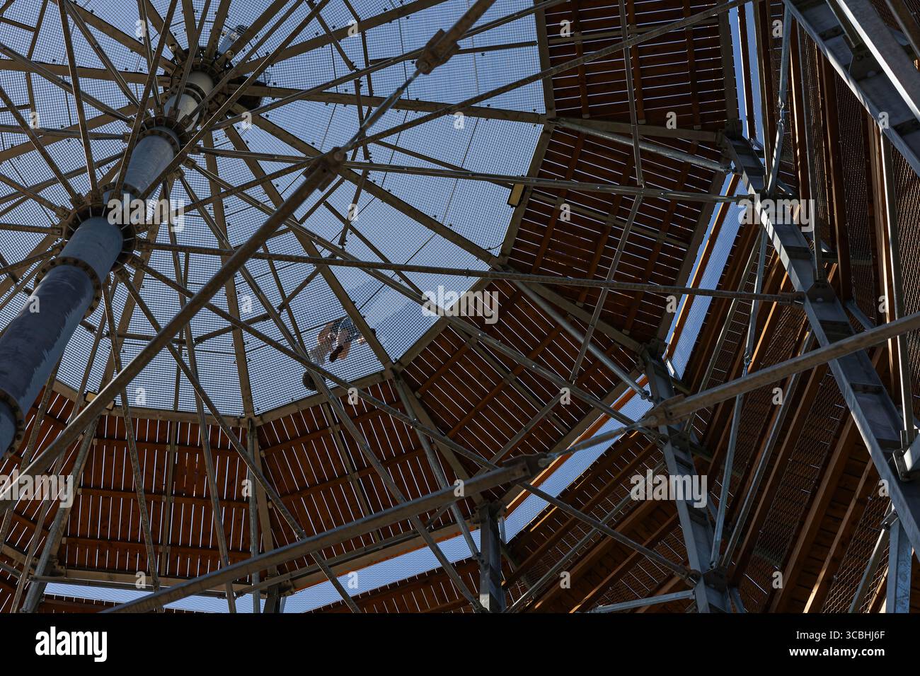 Metallic structure of observation tower with wooden platforms and ...