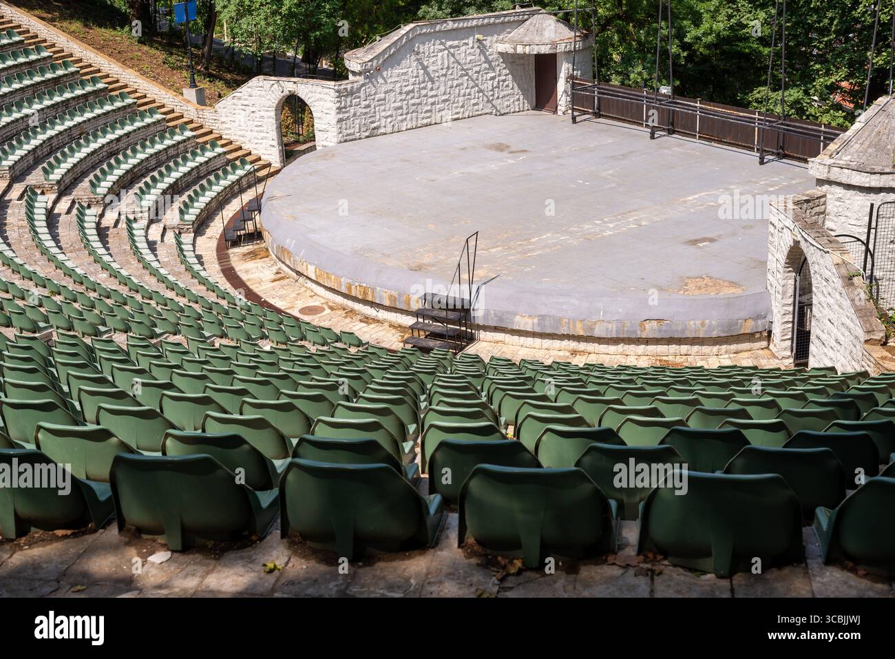 Amphitheater with concentric rows of tiered seating curving around a ...