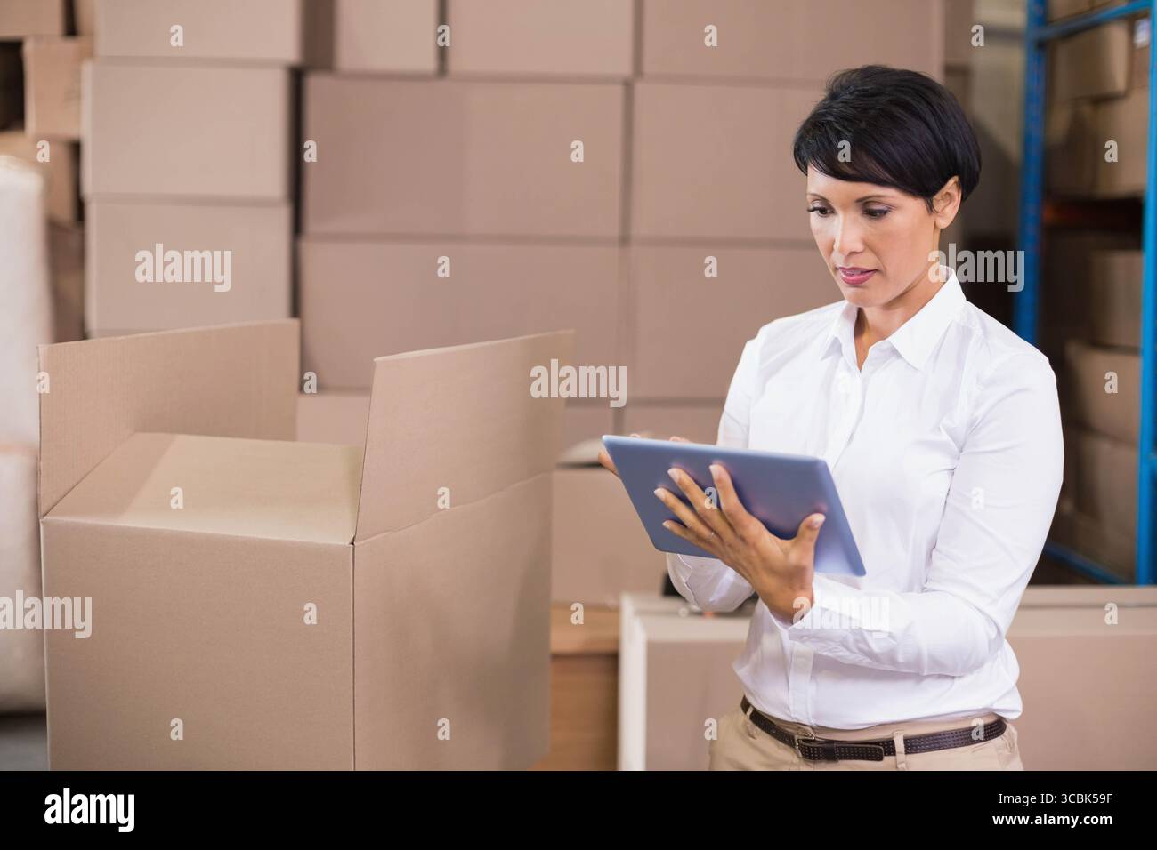 Woman tapping tablet man reviewing hi-res stock photography and images - Alamy