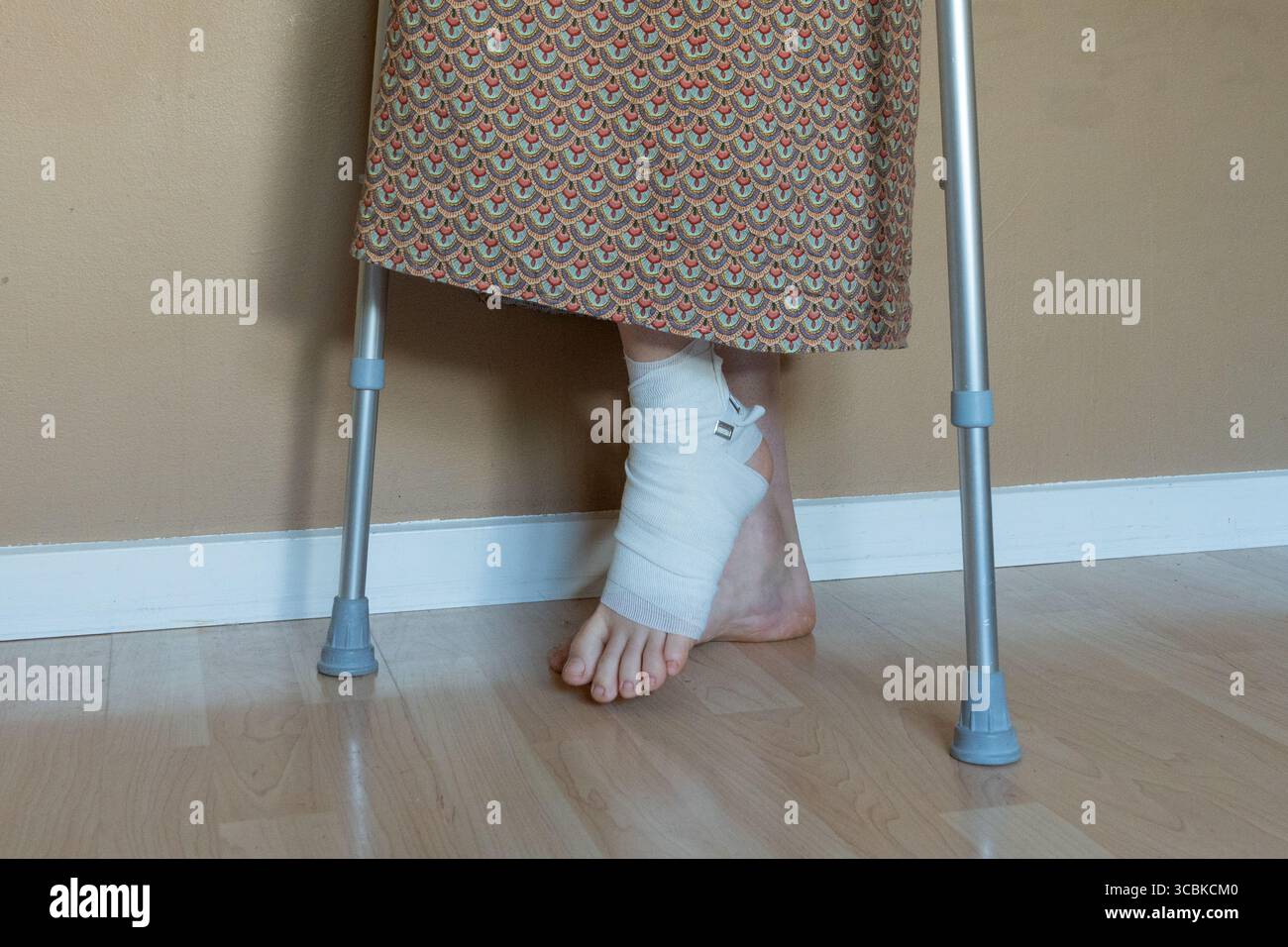 Person with sprained foot using crutches, healing process Stock Photo ...