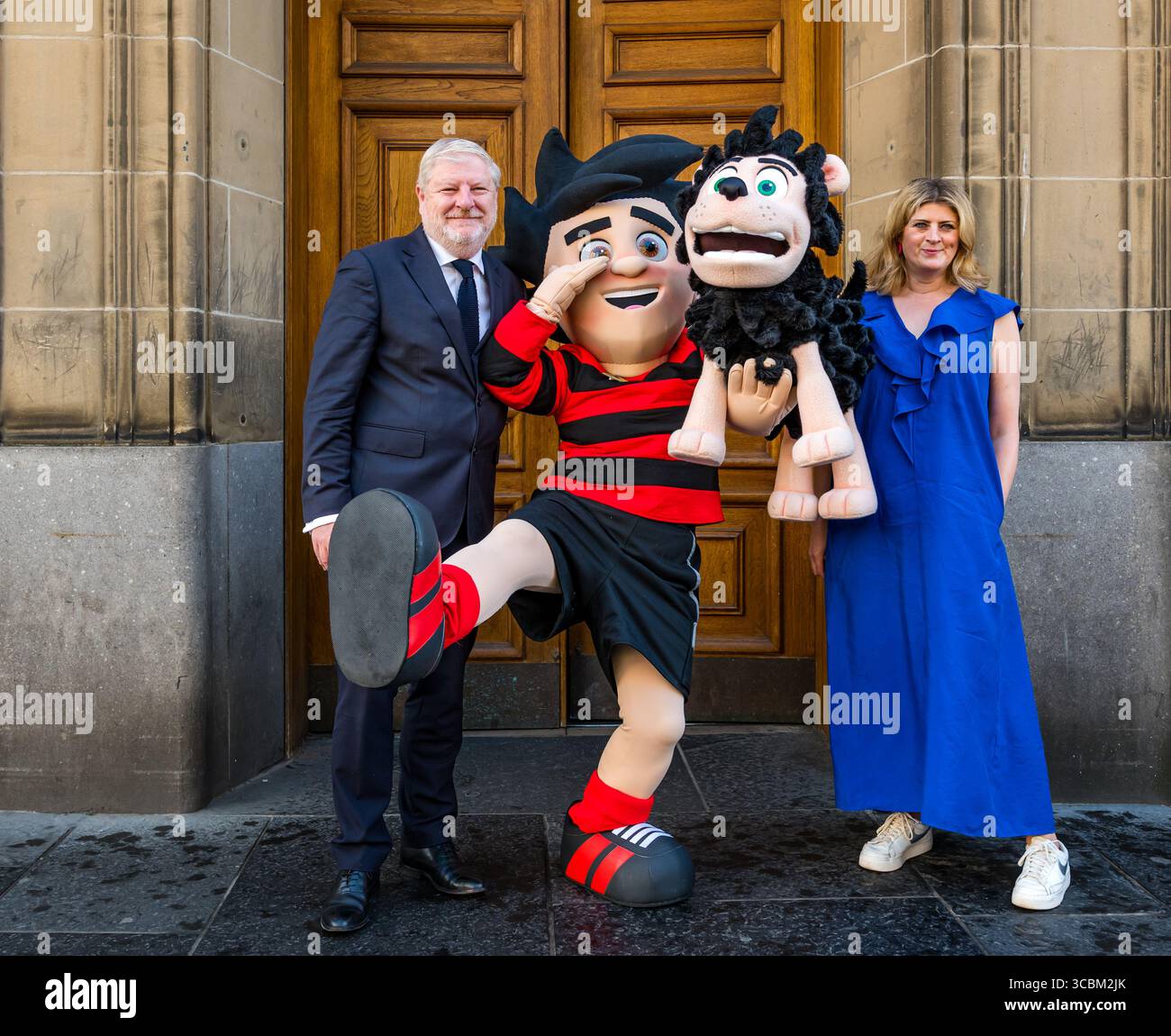 Culture minister Angus Robertson & Amina Shah with Dennis the Menace ...