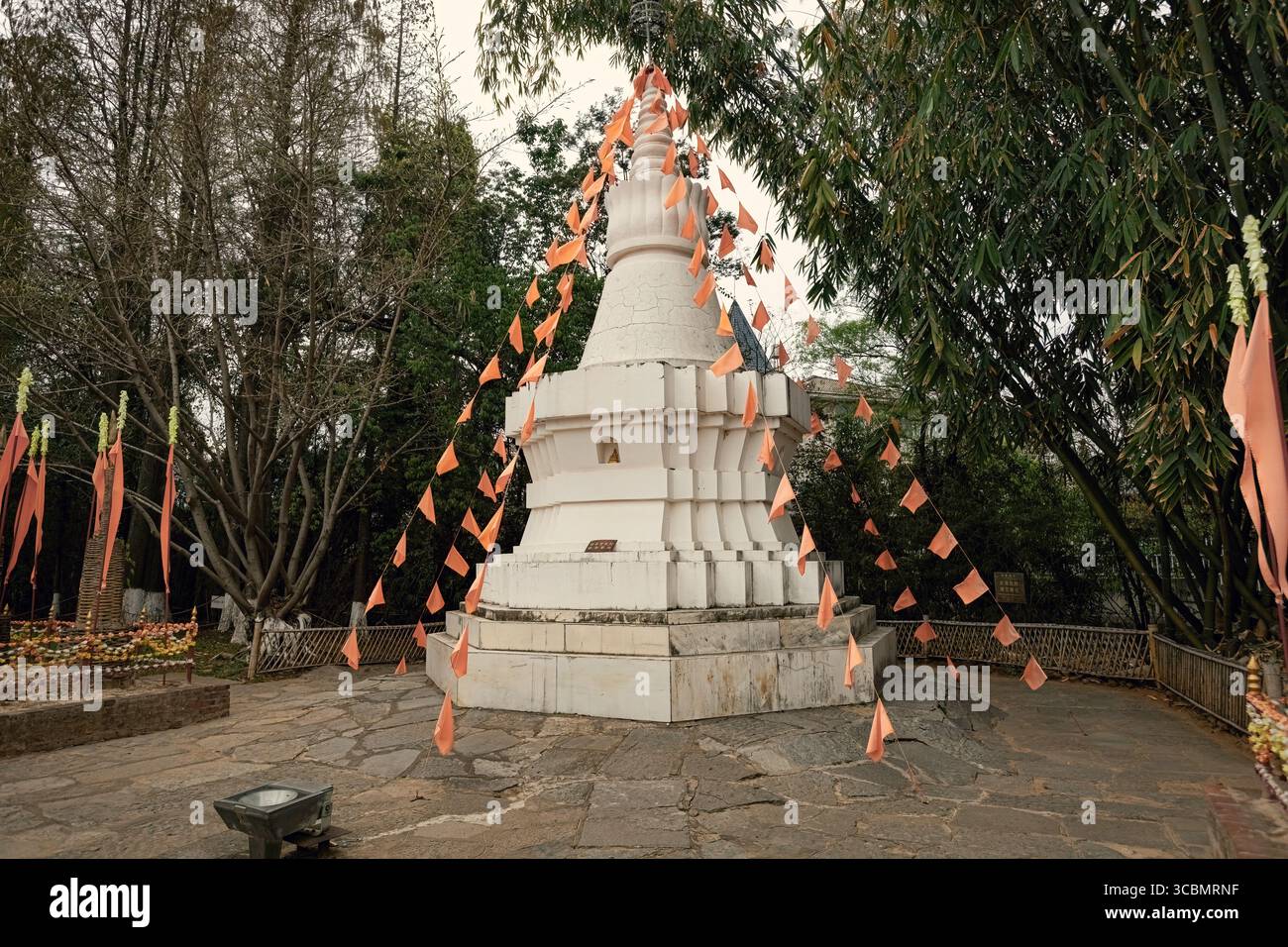 Buddhist stupa with flags in the Chinese temple in Kunming China Stock ...
