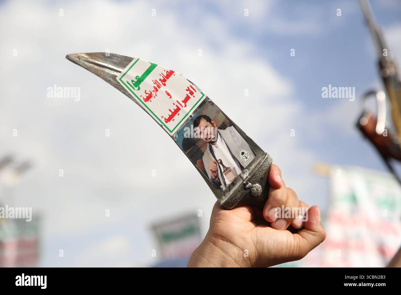 YEMEN HOUTHIS USA ISRAEL CONFLICT A Houthi supporter holds up dagger ...