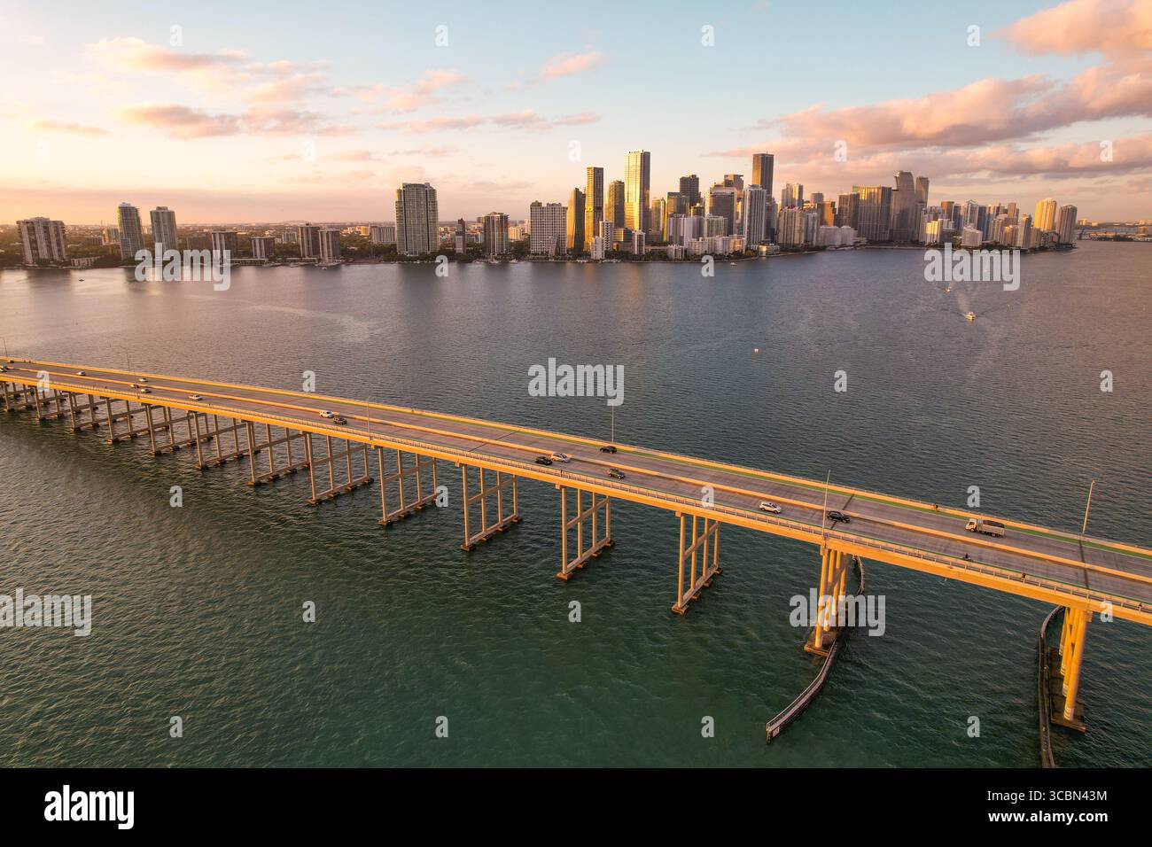 Aerial view of a bridge stretching across the water towards the ...