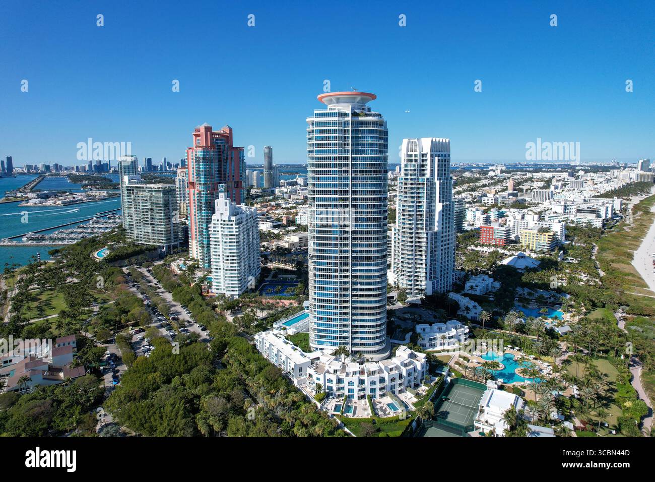 Aerial view of gleaming skyscrapers pierce the azure sky, juxtaposed ...