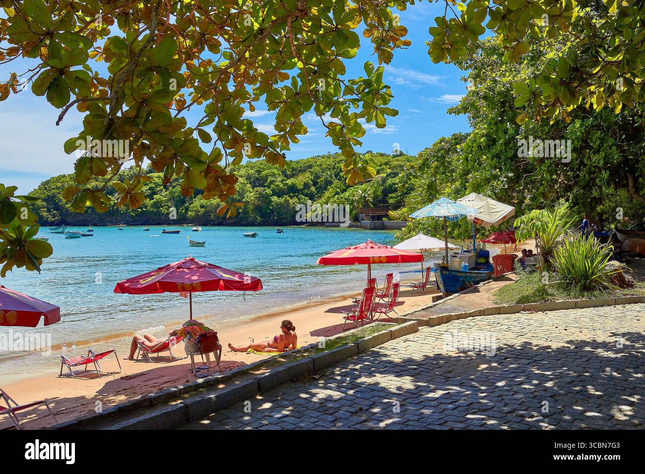 Tourists sunbathing relaxing under hi-res stock photography and images ...