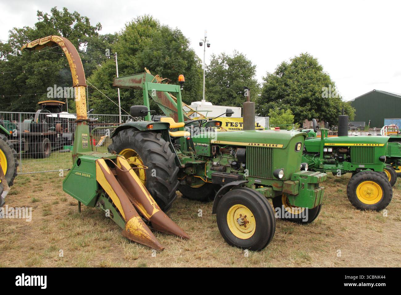 beautiful big green american tractors at a field at a historic farm ...