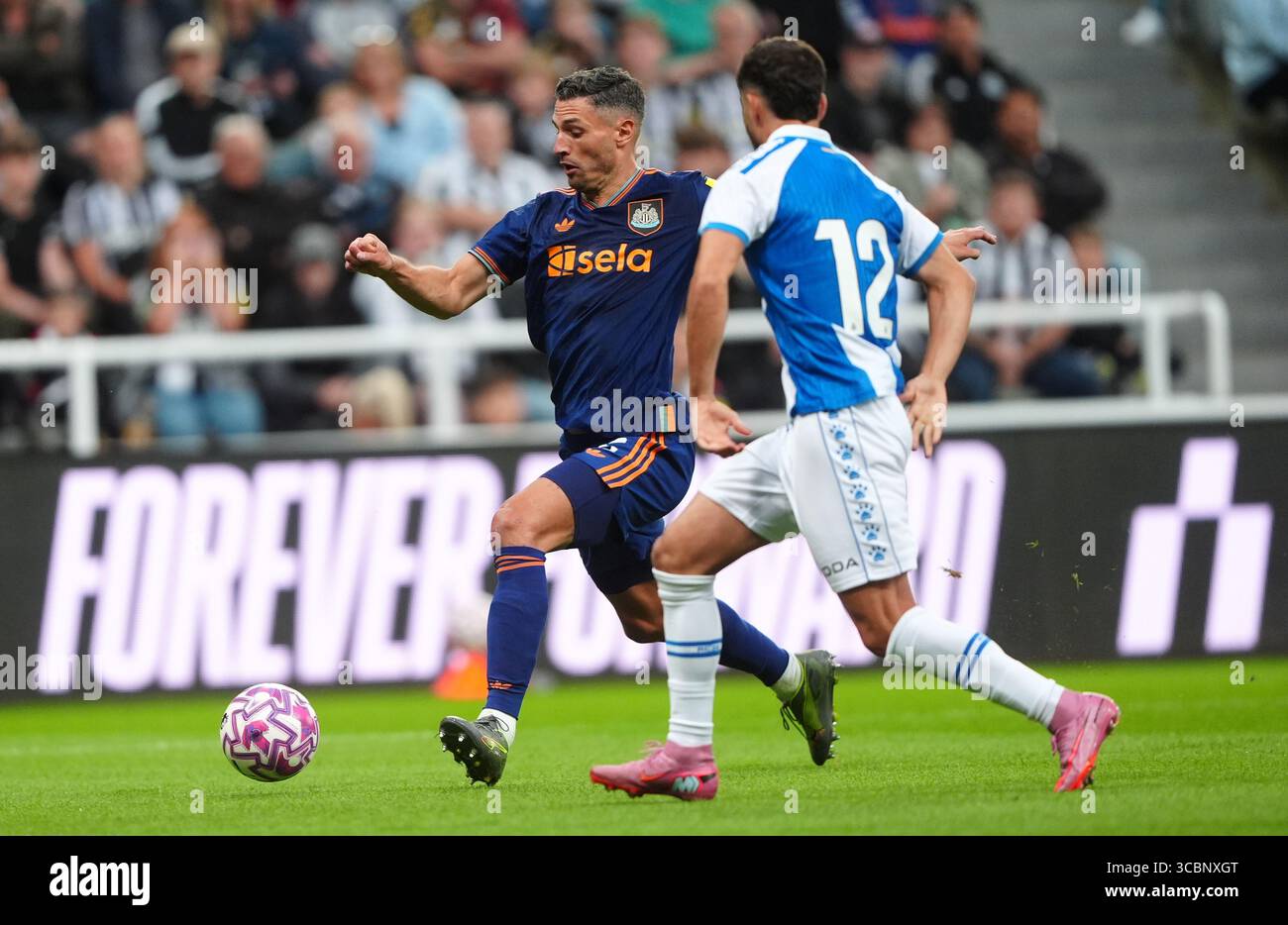 Newcastle United's Fabian Schar (left) and Espanyol's Jose Salinas ...