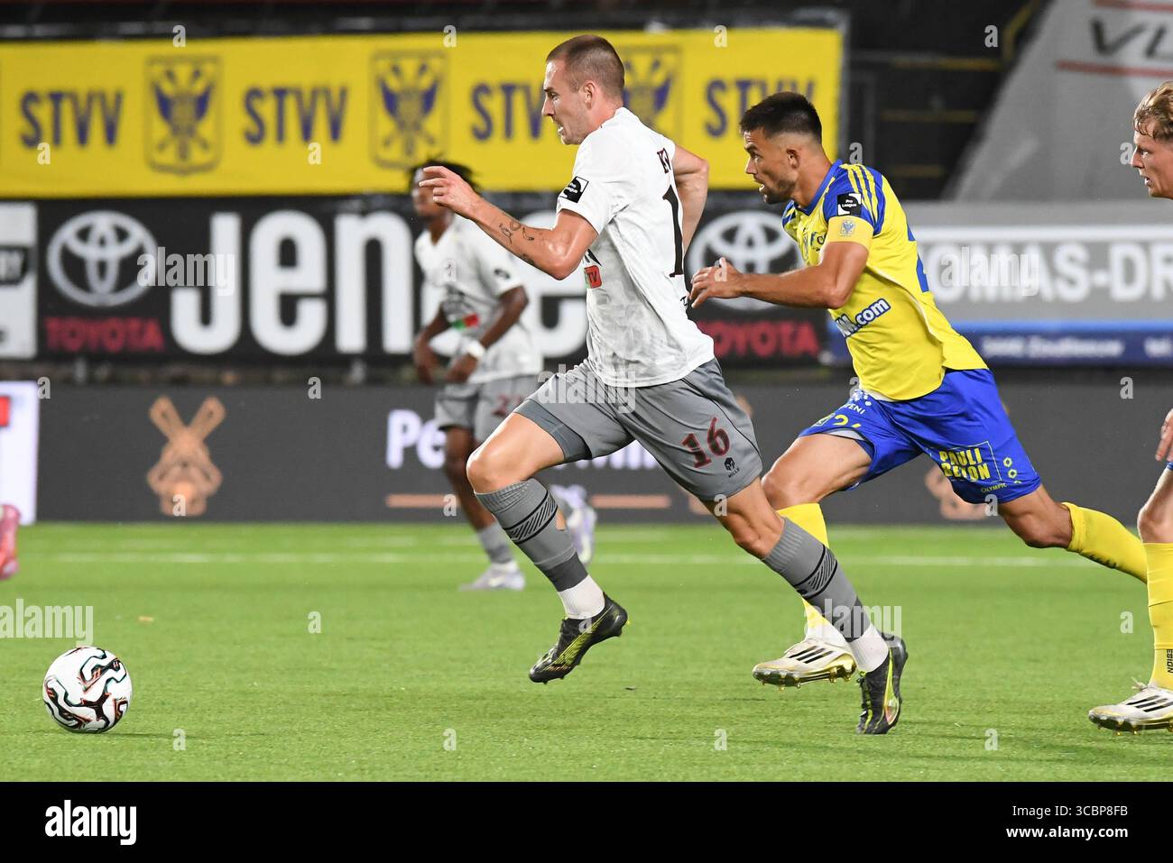 Dender's Roman Kvet and STVV's Visar Musliu pictured in action during a ...
