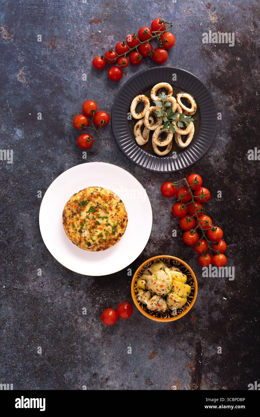 Flatlay of M&S mezze selection featuring fried calamari rings ...