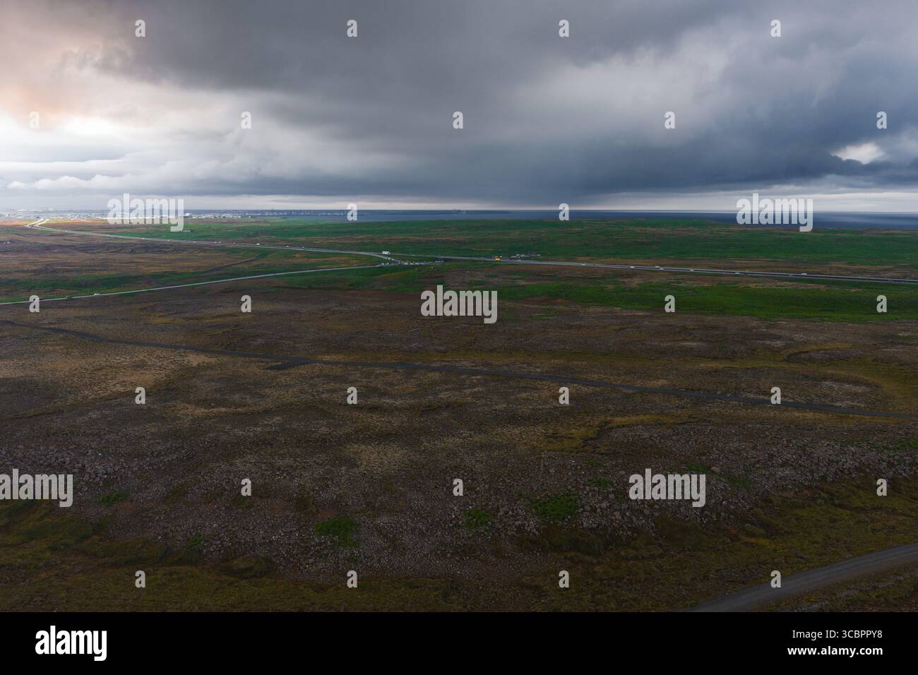 Aerial View of Icelandic Landscape with Roads and Distant Settlement ...