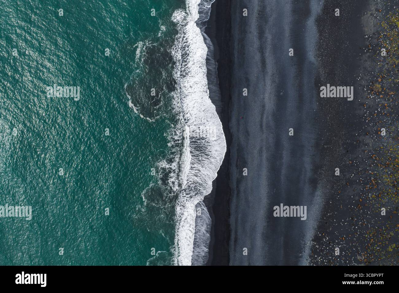 Aerial View of Iceland's Black Sand Beach and Turquoise Ocean Waters ...