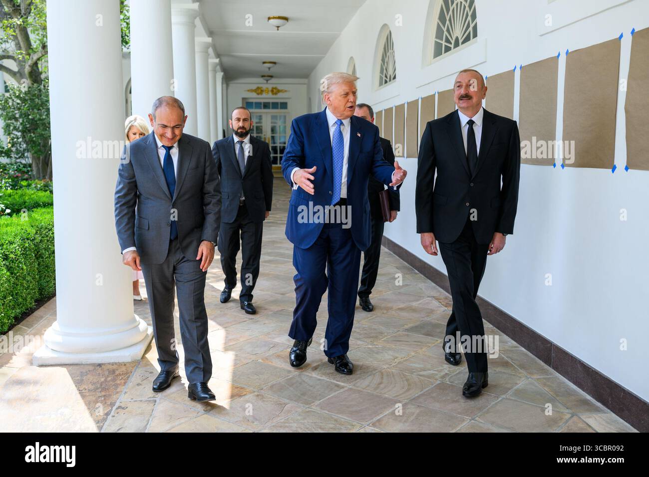 President Donald Trump walks with President Ilham Aliyev of Azerbaijan ...