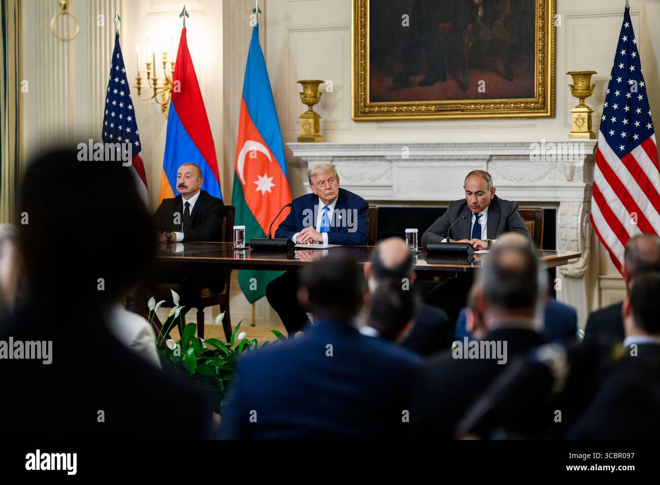 President Donald Trump signs a trilateral joint declaration with ...