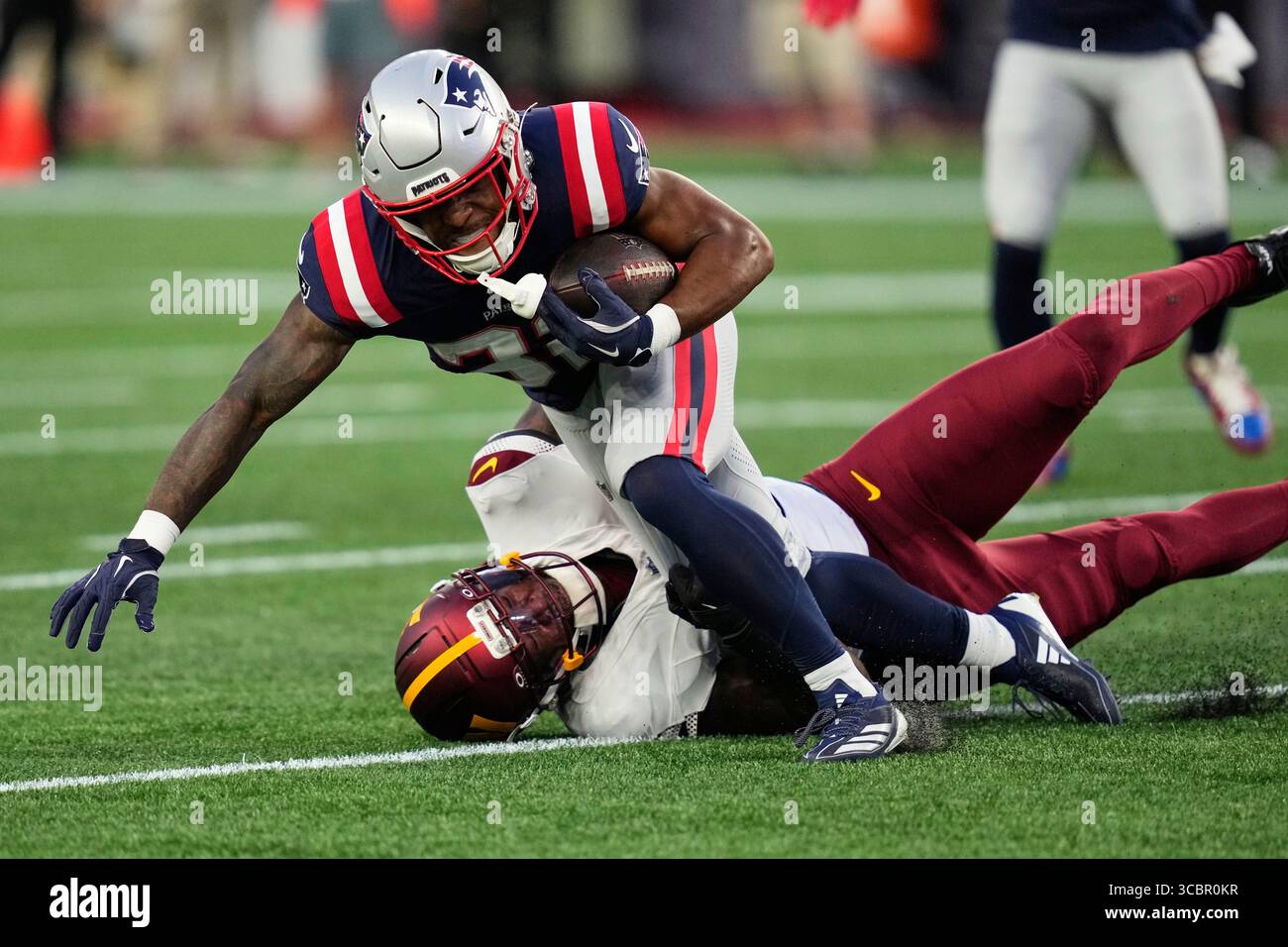 Washington Commanders defensive end Clelin Ferrell tackles New England ...