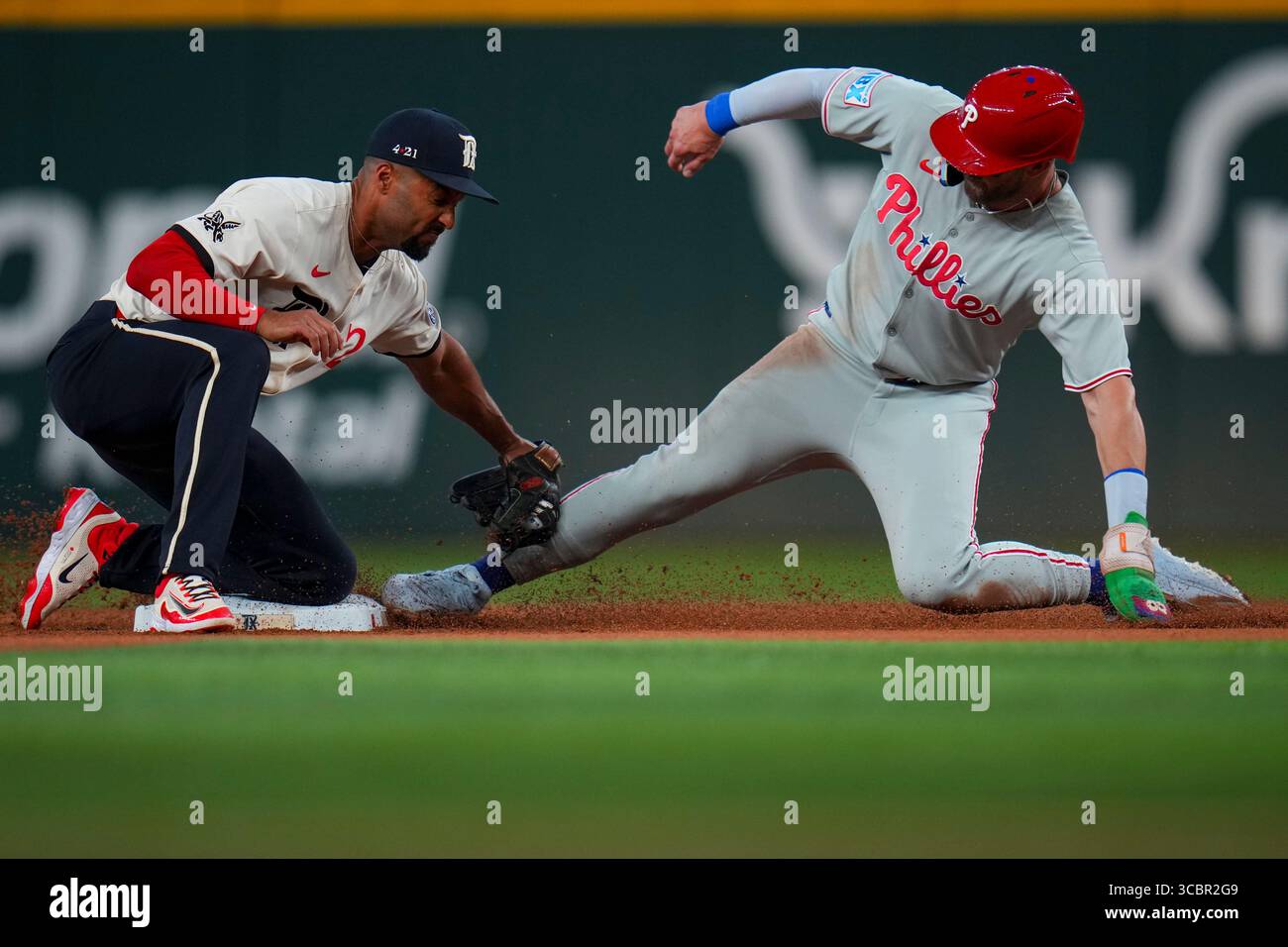 Texas Rangers second baseman Marcus Semien, left, tags out Philadelphia ...