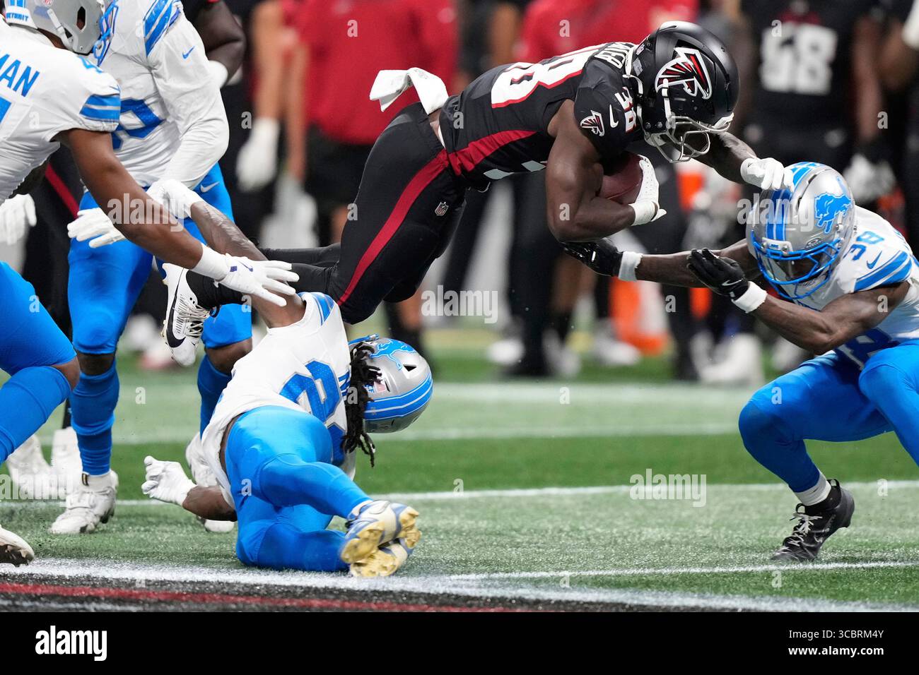 Detroit Lions safety Morice Norris (26) is hit in the helmet by Atlanta ...