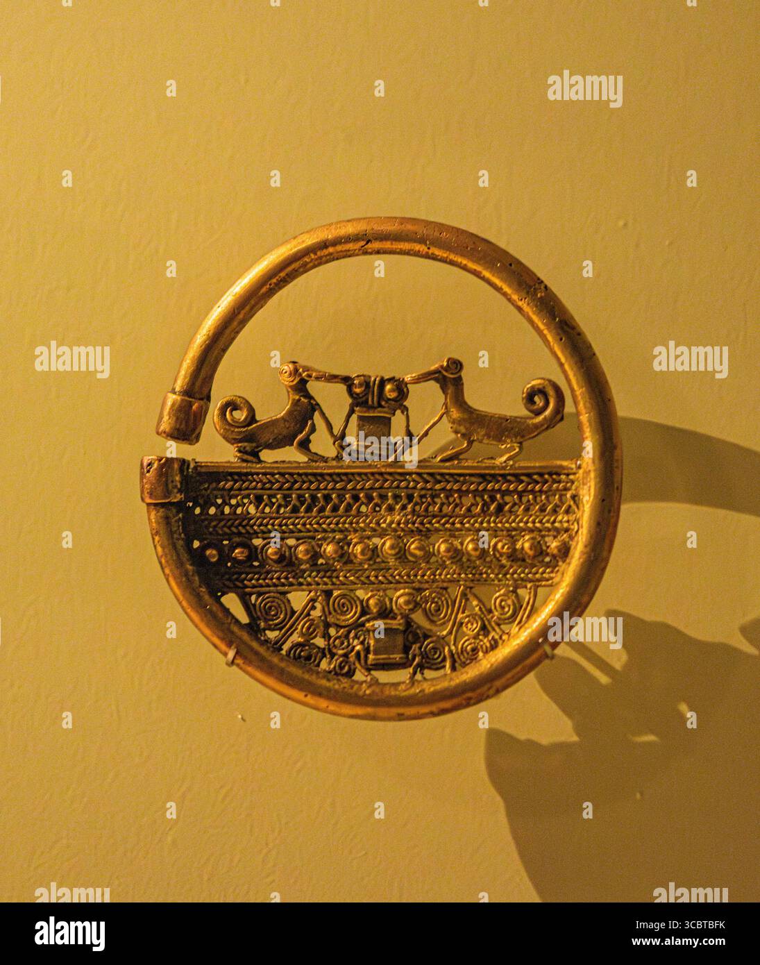 Intricate pre-Columbian gold artifact featuring detailed animal motifs ...