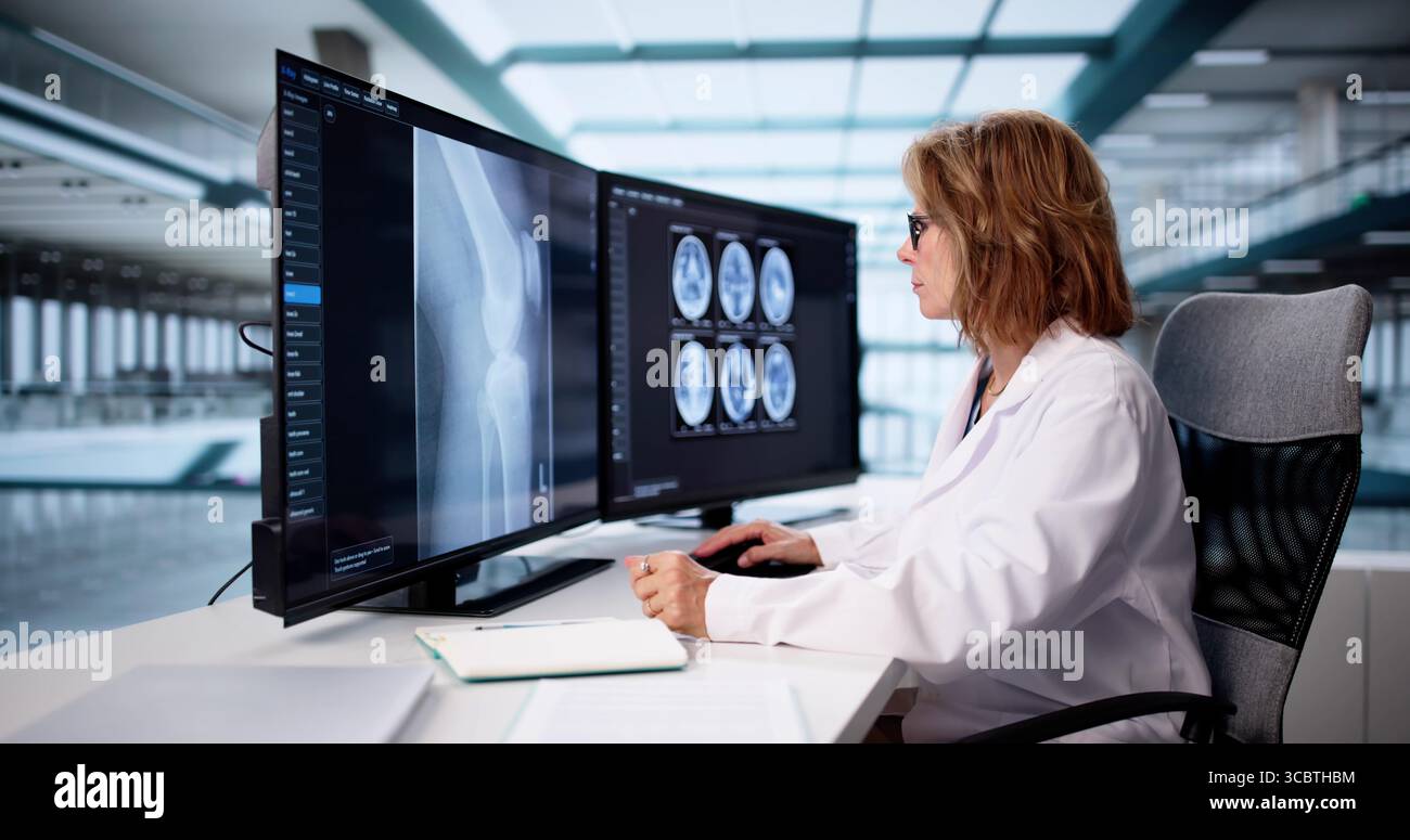 Older Radiologist Analyzing Neuro Images On Computer, Collaborating ...
