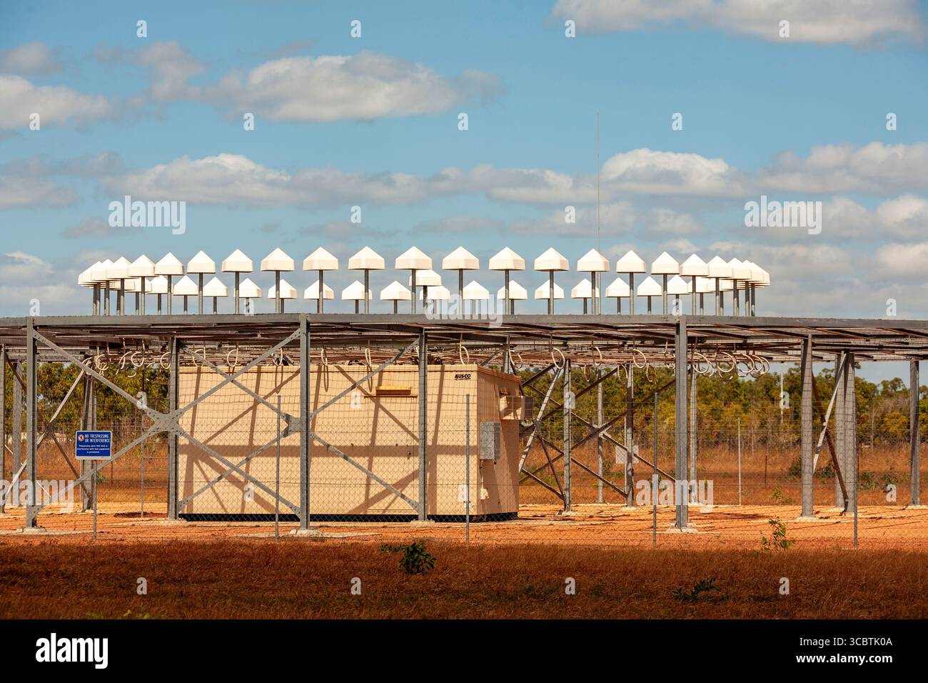 large round circle of dome white shaped cones inside a security fence ...