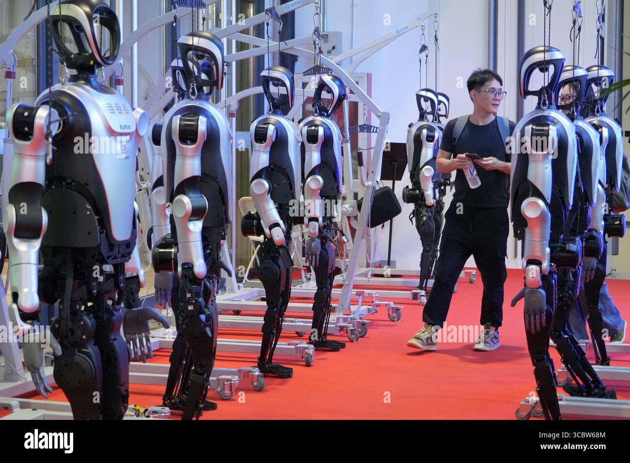 BEIJING, CHINA - AUGUST 8, 2025 - The audience walked past a group of ...
