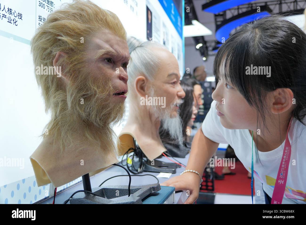 BEIJING, CHINA - AUGUST 8, 2025 - A viewer watches a bionic humanoid ...