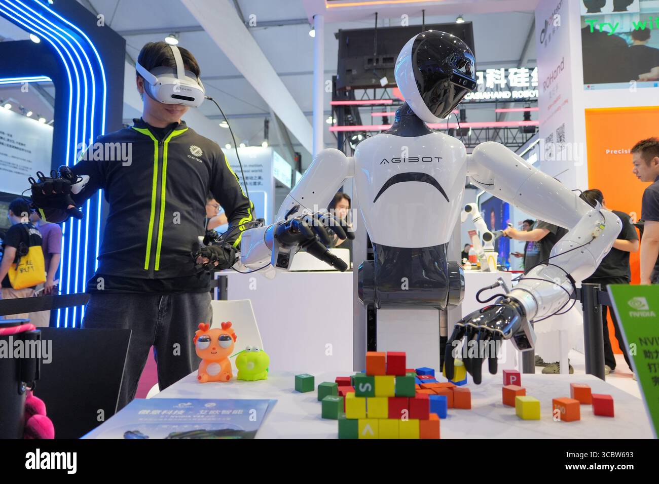 BEIJING, CHINA - AUGUST 8, 2025 - A staff member demonstrates remote ...