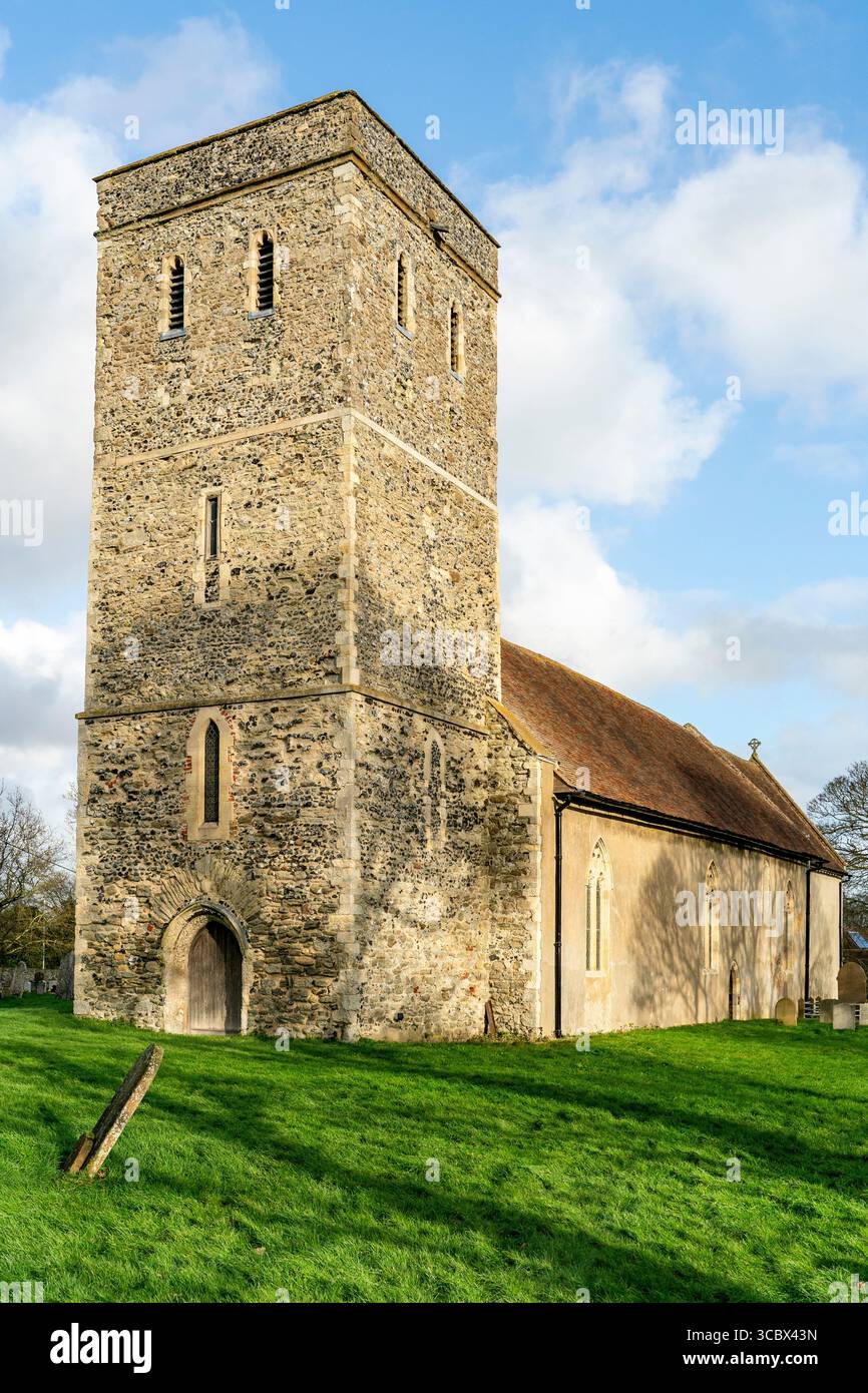 The tall 12th century unbuttressed tower with its 14th century ...
