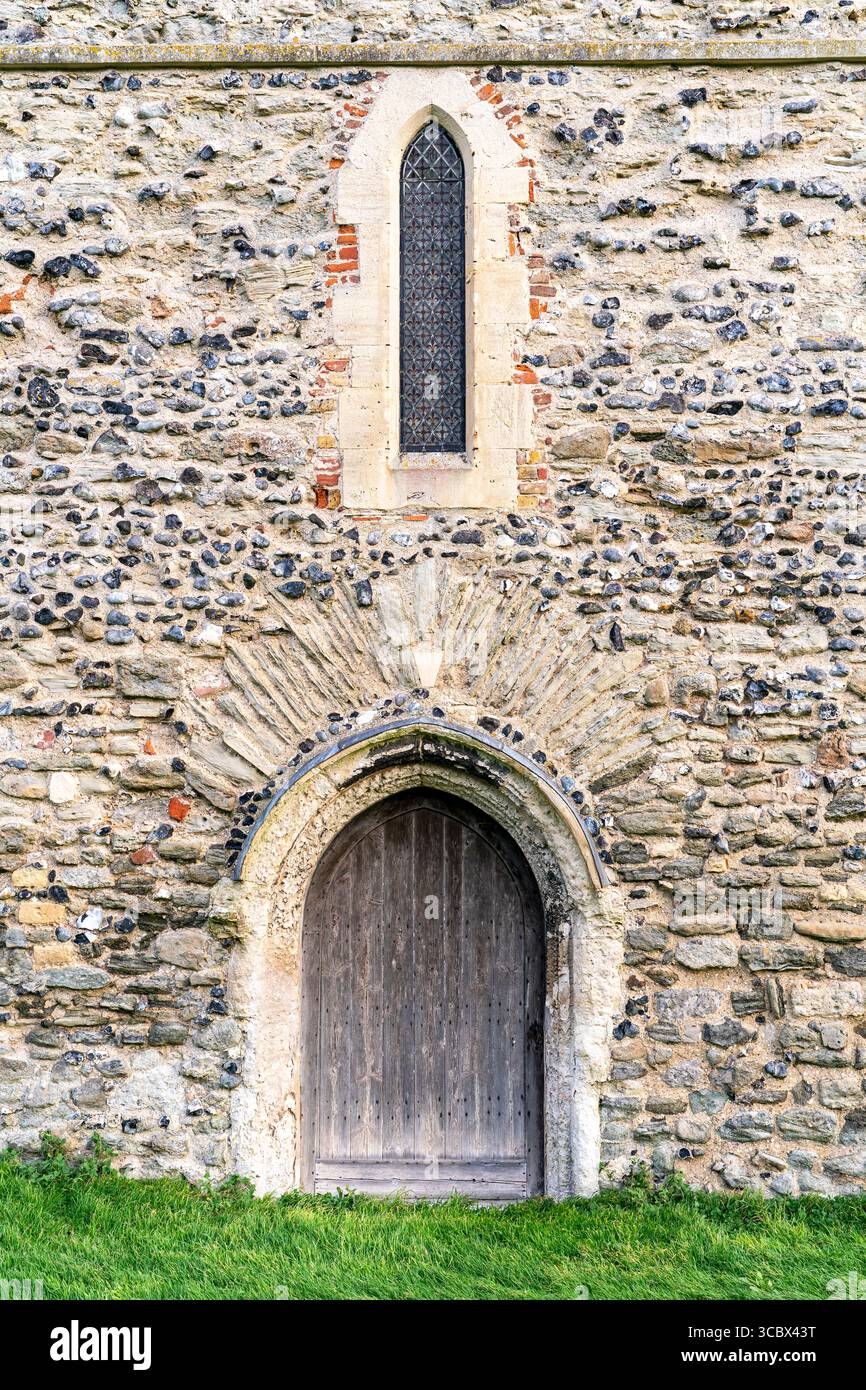 Doorway with a single lancet window above in the tower of the Norman ...