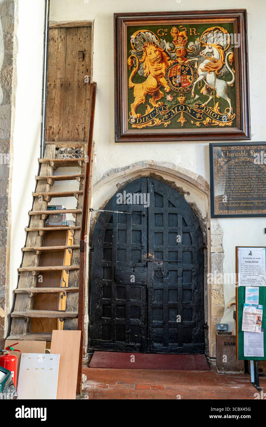 Coat of arms of George III above the medieval door of St Nicholas at ...